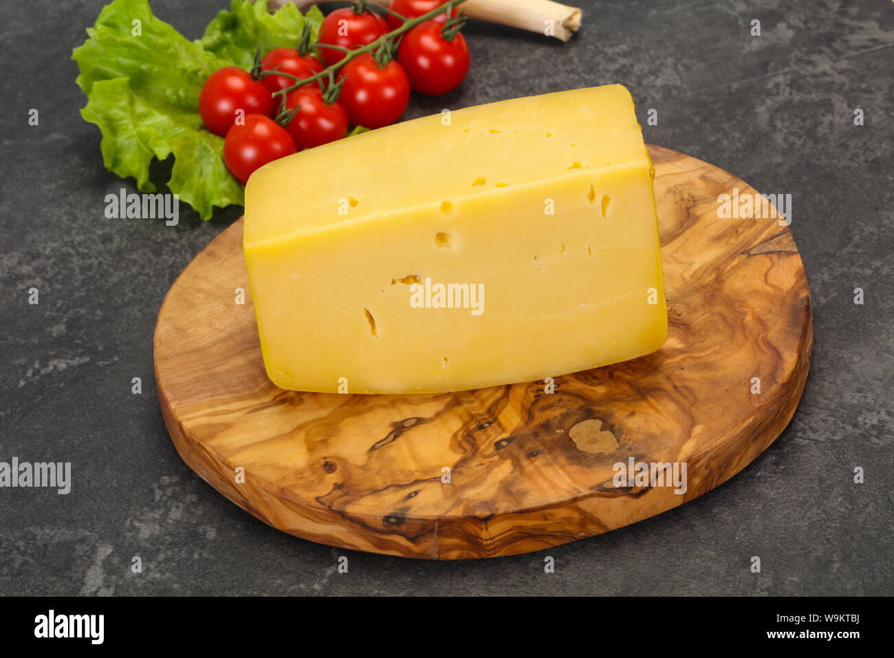 Swiss Hard yellow tasty cheese brick Stock Photo - Alamy