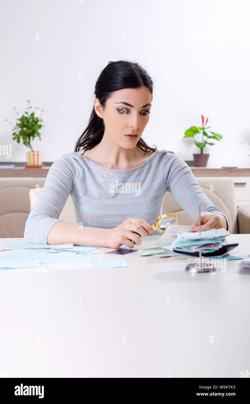 The young woman in budget planning concept Stock Photo - Alamy