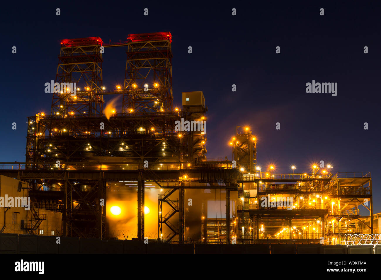 Night industrial landscape with bright lights of lanterns - 4-drum ...