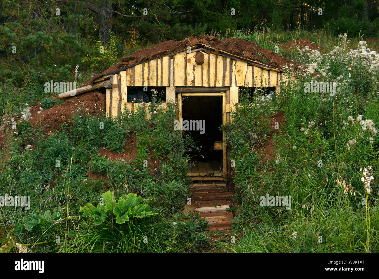 unfinished dugout or burdei shelter in the hillside Stock Photo - Alamy
