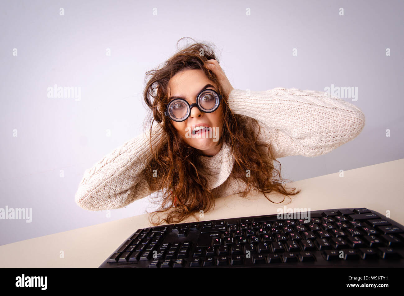 The funny nerd girl working on computer Stock Photo - Alamy