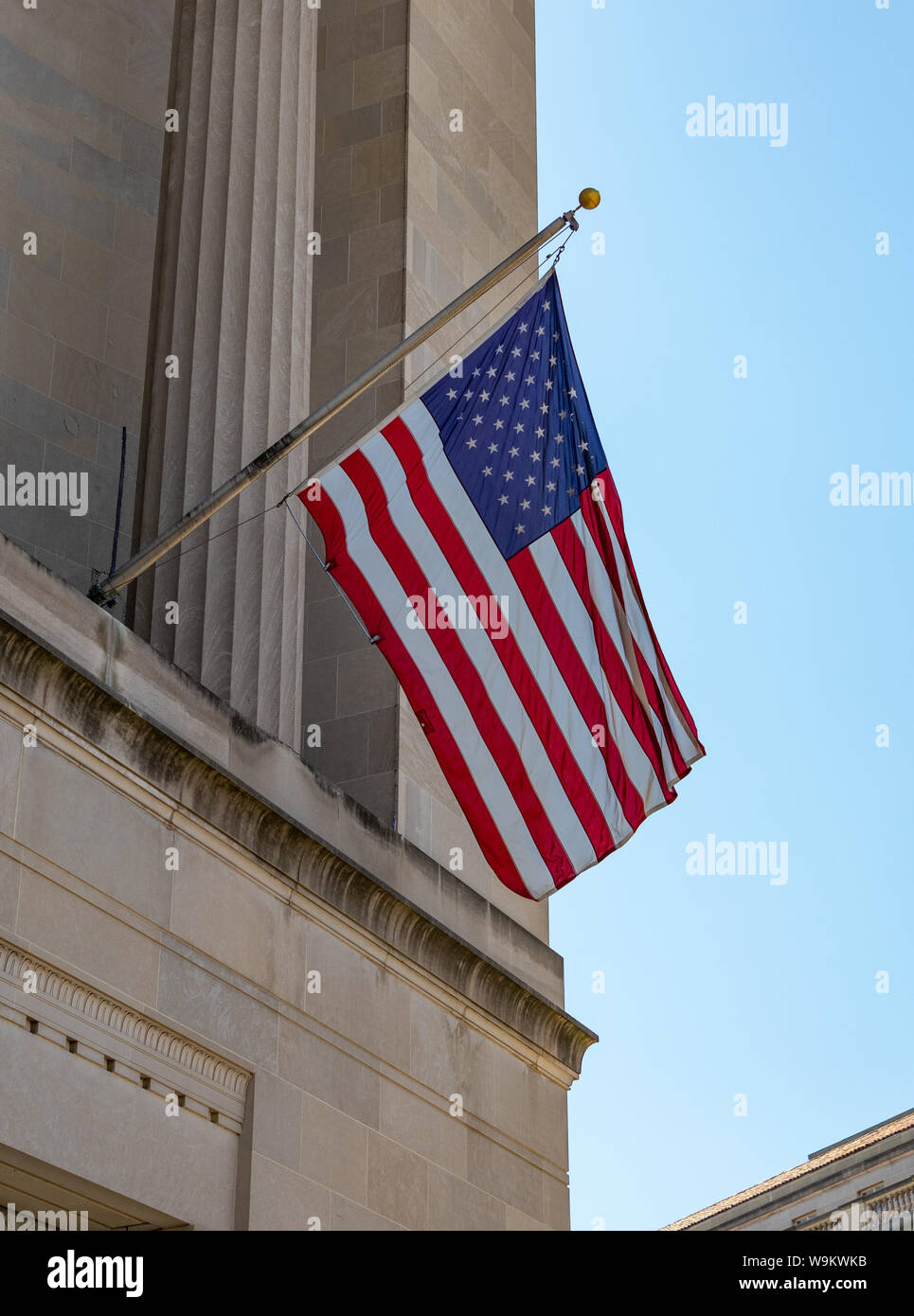 A picture of an American flag hanging off a building, in Washington ...