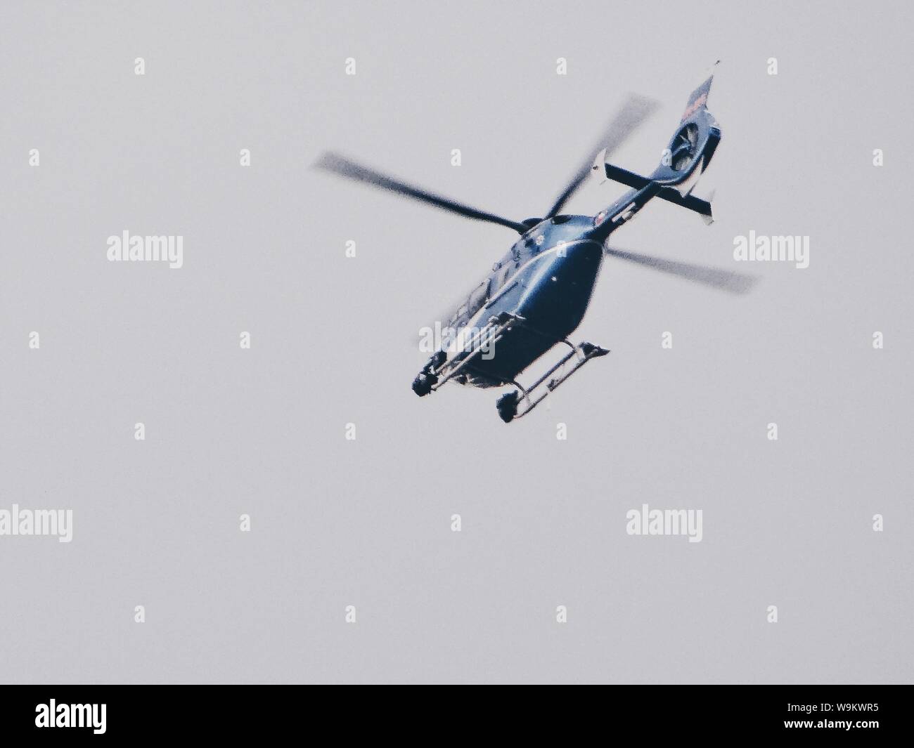 Journalist helicopter flying in the sky with a grey background Stock ...