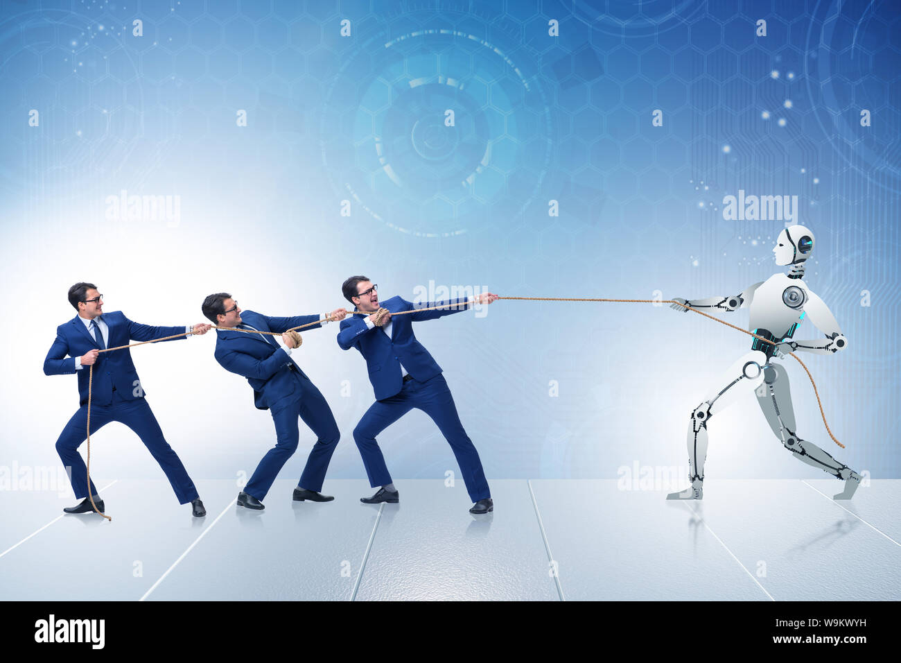 The competition between humans and robots in tug of war concept Stock ...
