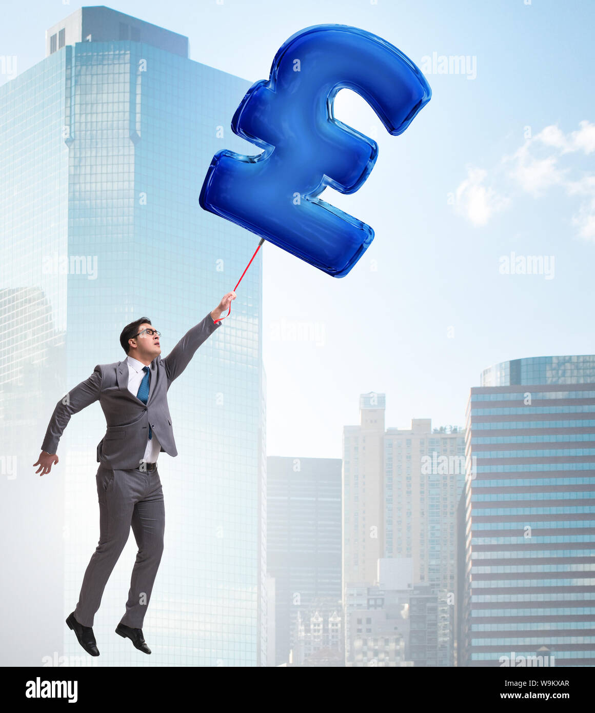 The businessman flying on british pound sign inflatable balloon Stock ...