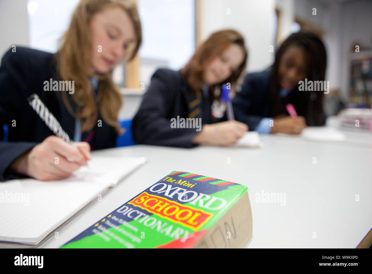Secondary School Class Hand Up High Resolution Stock Photography and ...