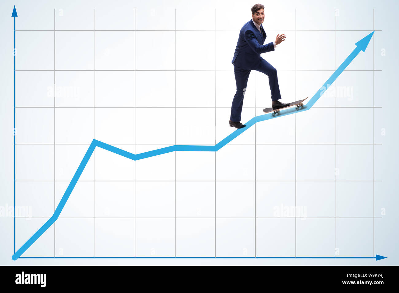 The businessman riding skateboard on financial graph Stock Photo - Alamy
