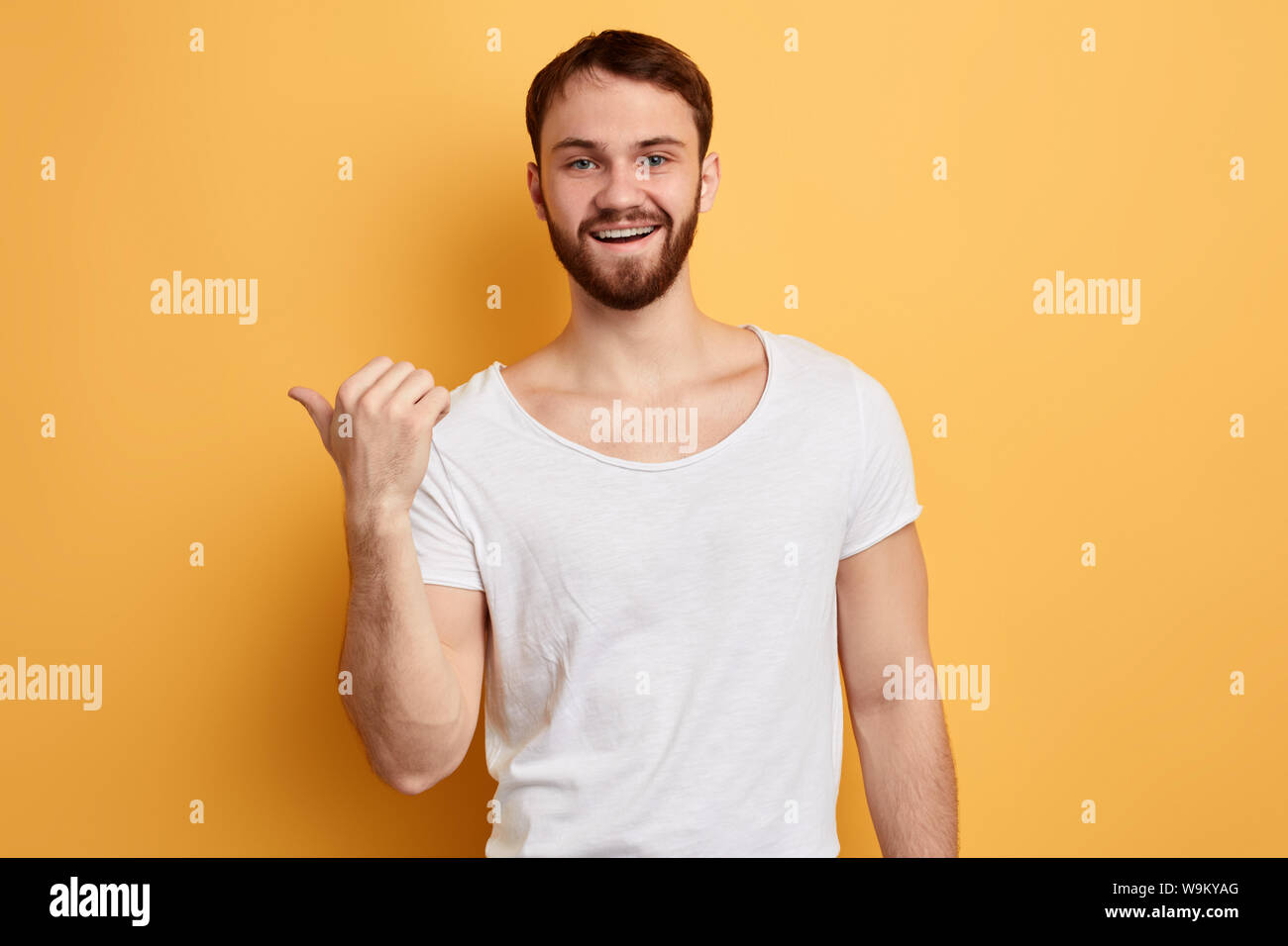 Pointing behind with her thumb hi-res stock photography and images - Alamy