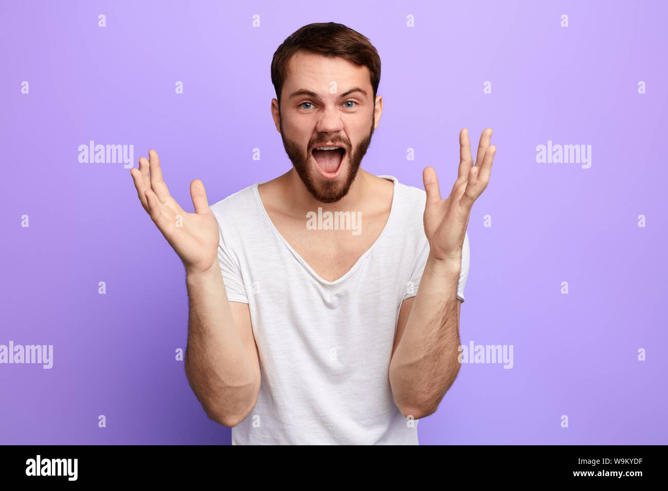 funny man with raised hands shouting at somebody, screaming. man ...