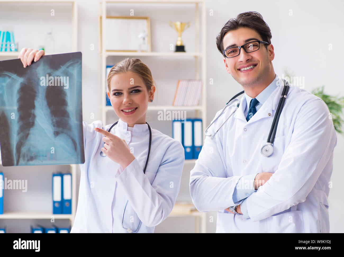 The two doctors examining x-ray images of patient for diagnosis Stock ...