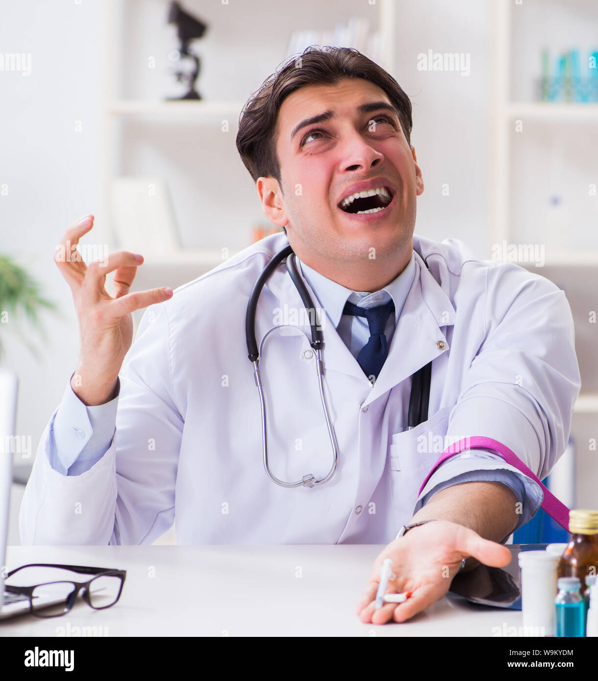 The doctor drug addict in the hospital Stock Photo - Alamy