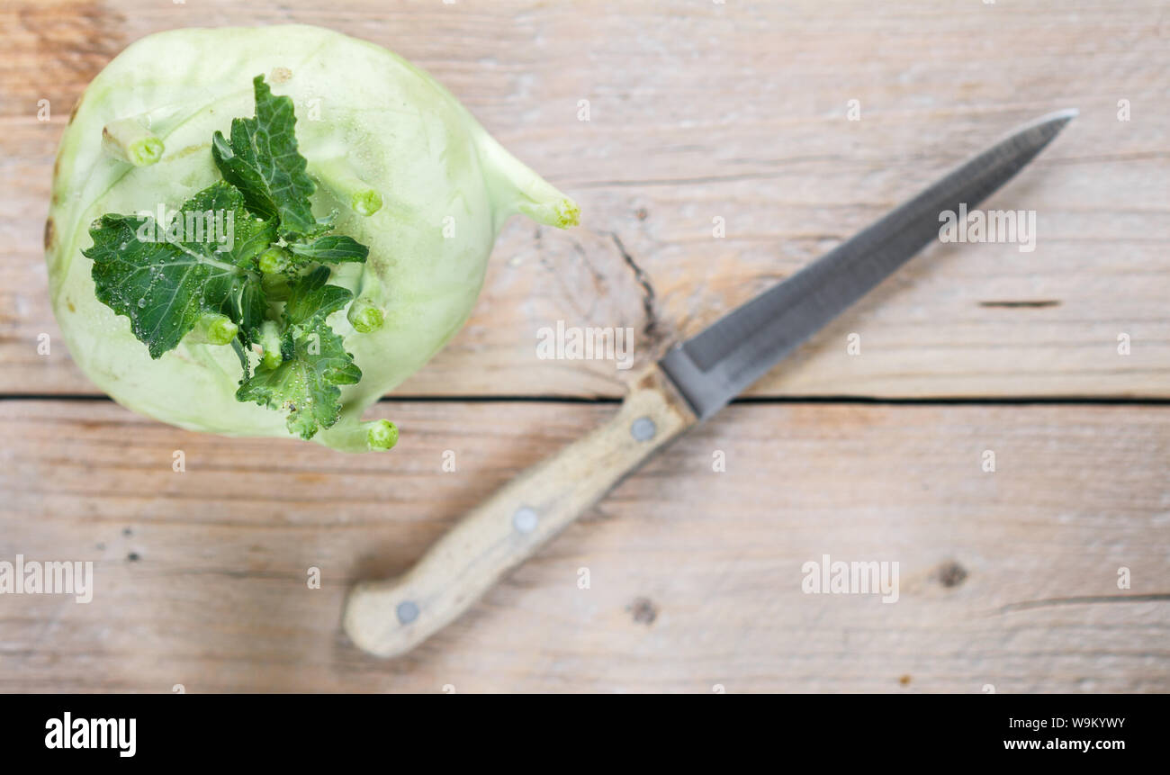 Fresh organic green kohlrabi cabbage on wooden table. The harvest of ...