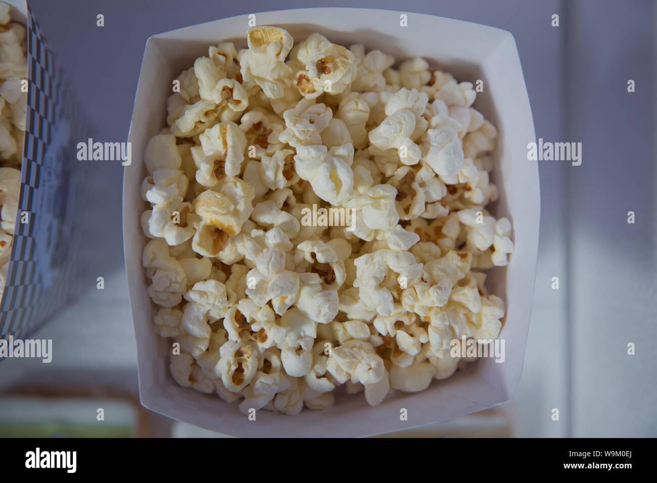 A wide classic box of theater popcorn isolated on white . Popcorn ...