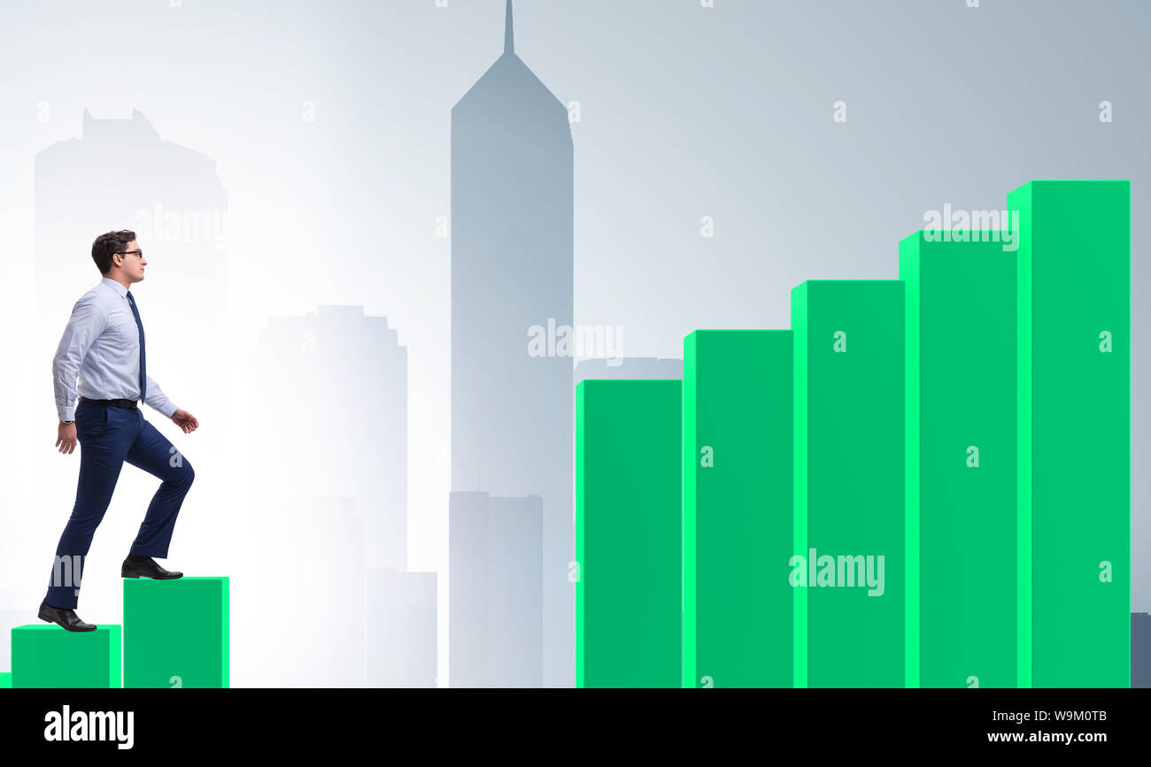 The businessman going up the bar chart in growth concept Stock Photo ...