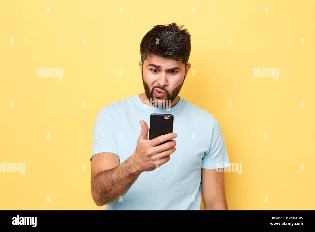 handsome man has recieved strange message, mobile crime. man has lost ...