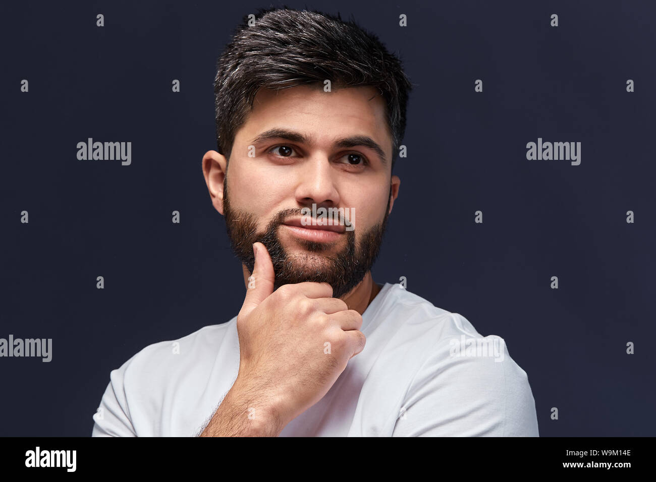 attractive Arab guy thinking about life, problems, looking aside ...