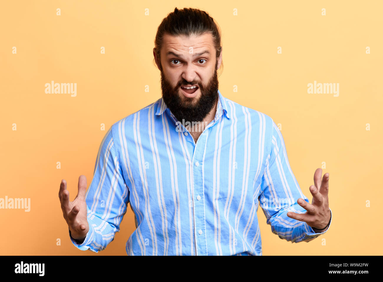 frustrated stylish man with open mouth expressing negative emotion ...