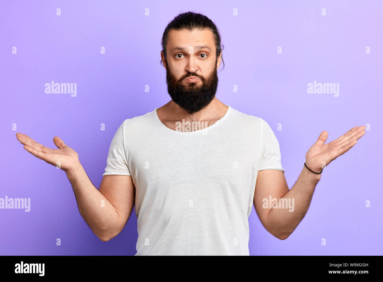 serious strong muscular man showing welcome gesture, greeting people ...