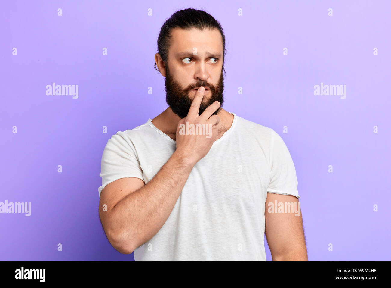 Portrait of young pensive thoughtful man with scared and anxious ...