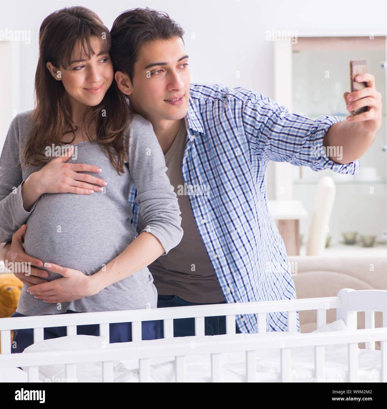 The young parents expecting their first baby Stock Photo - Alamy