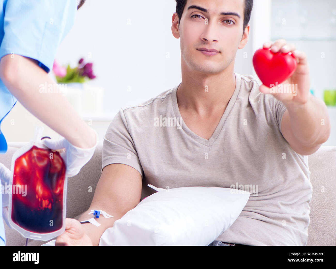 The patient getting blood transfusion in hospital clinic Stock Photo ...