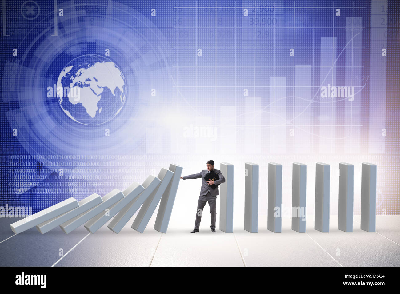 The businessman preventing domino effect in business concept Stock ...