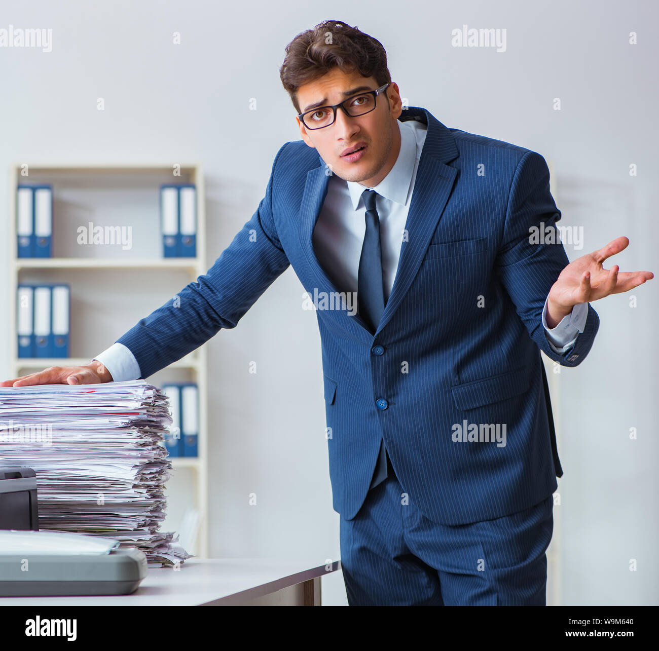 The businessman making copies in copying machine Stock Photo - Alamy