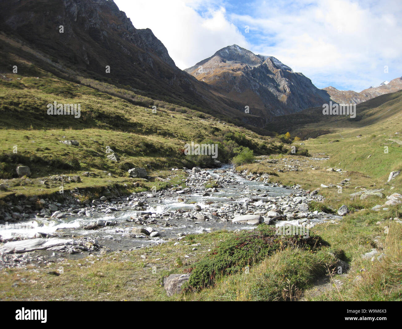mountain river making its way through the alpine scenery Stock Photo ...