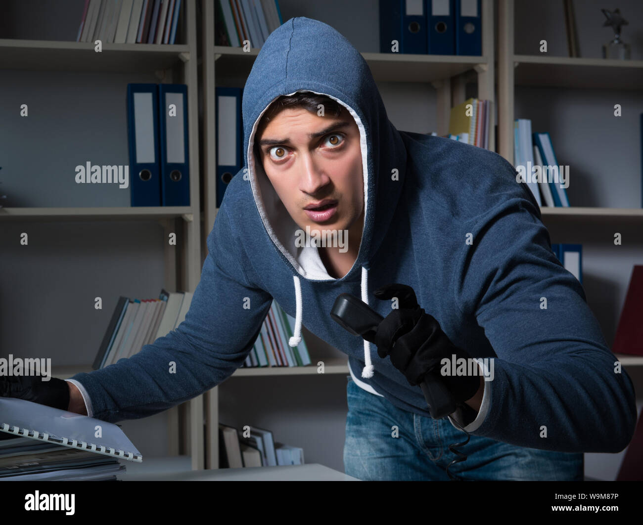 The young man in industrial espionage concept Stock Photo - Alamy