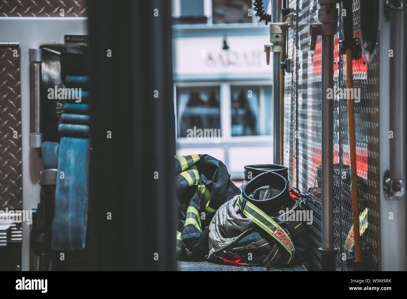 Shot of firefighter uniform on the floor of a fire engine Stock Photo ...