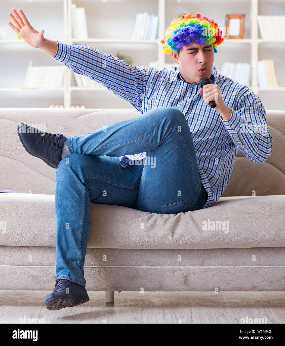 The funny man singing songs in karaoke at home Stock Photo - Alamy