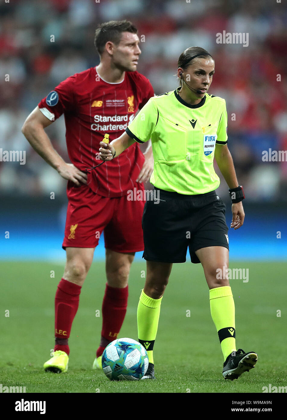 Liverpool's James Milner and match referee Stephanie Frappart during ...