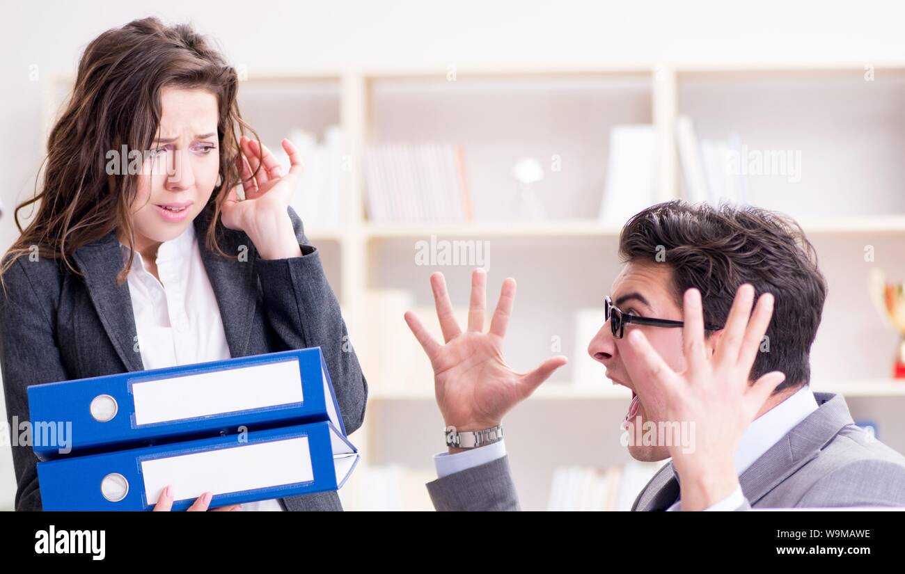 The angry boss unhappy with female employee performance Stock Photo - Alamy