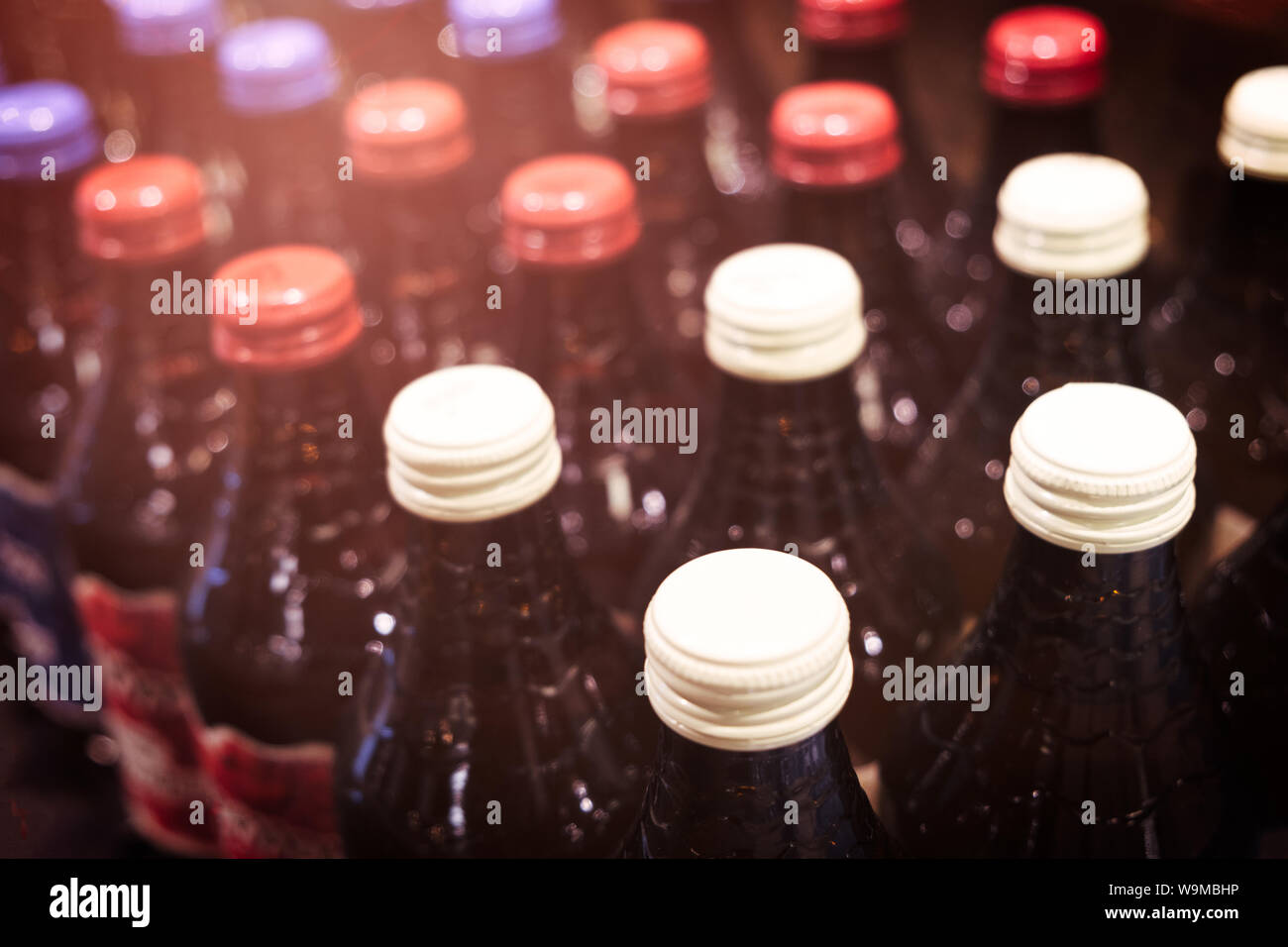 Rows of water, beer, juice, alcohol bottles in a row at the supermarket ...
