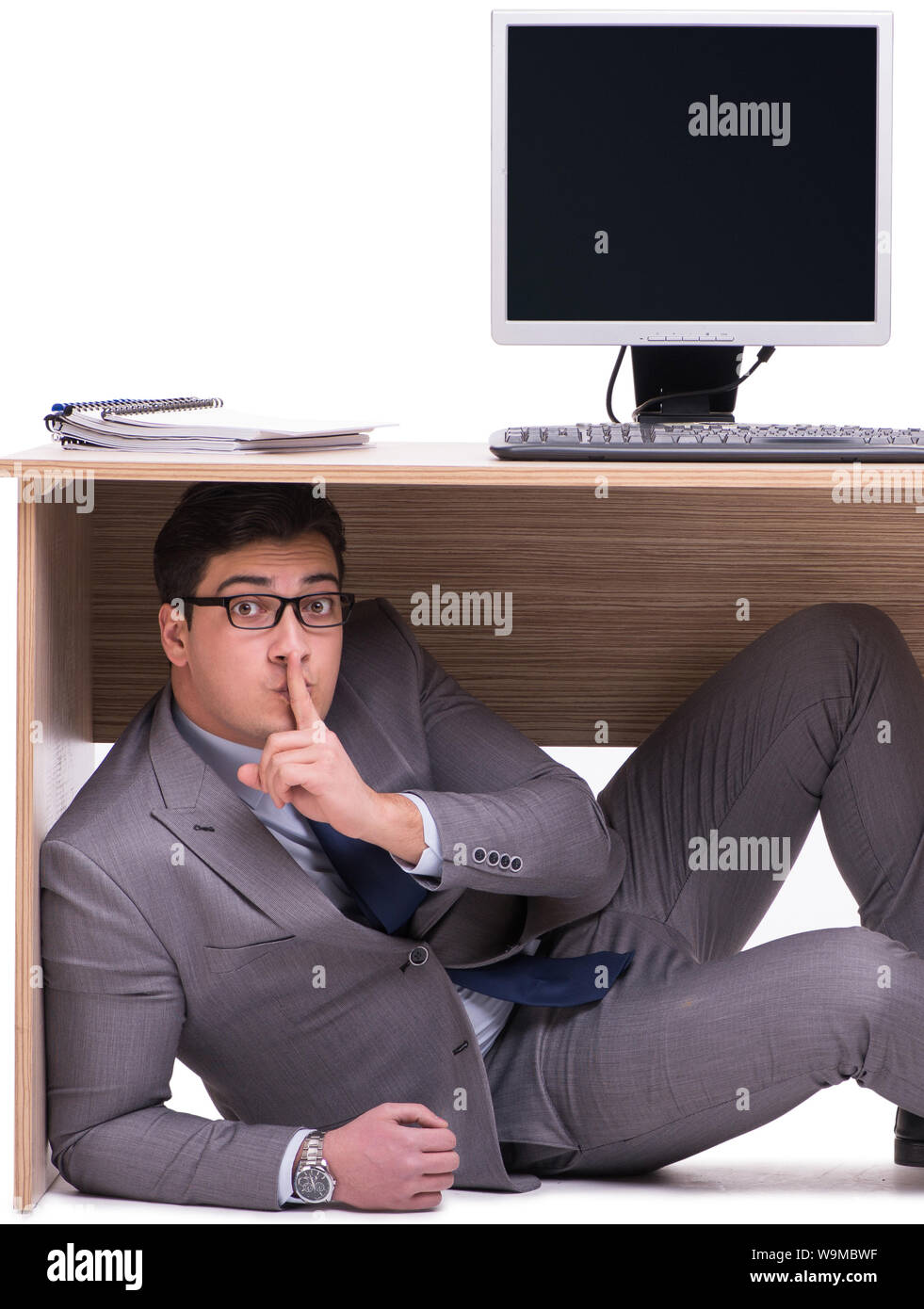 The businessman hiding in the ofice Stock Photo - Alamy