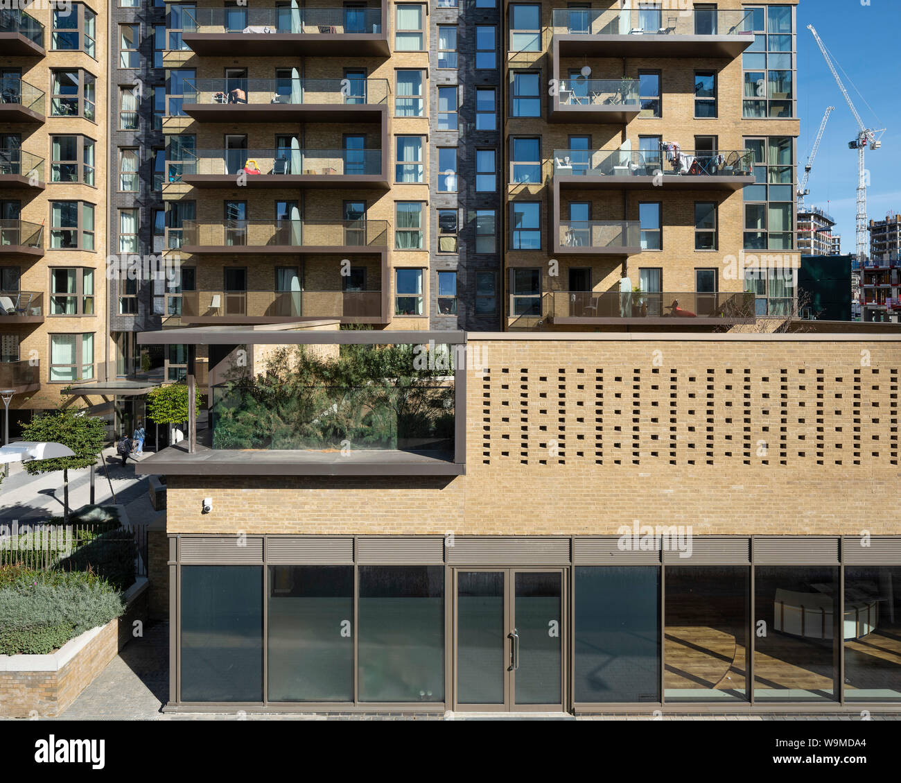 Juxtaposition of building entrance and multi-storey facade. Wembley ...