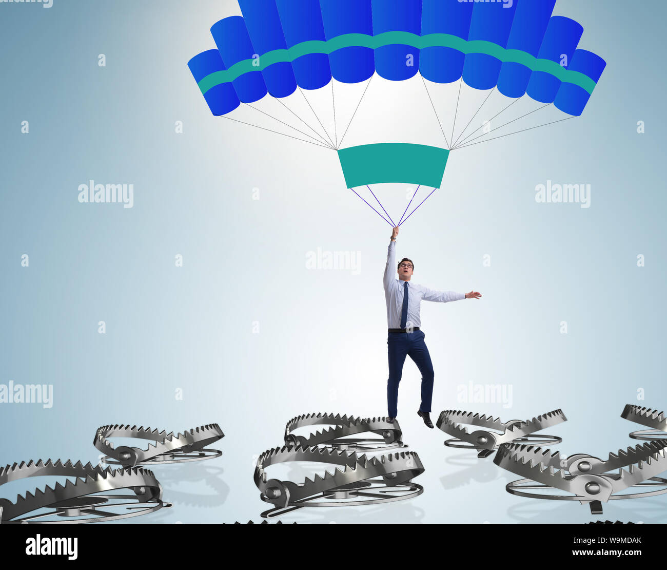 The businessman falling into trap on parachute Stock Photo - Alamy