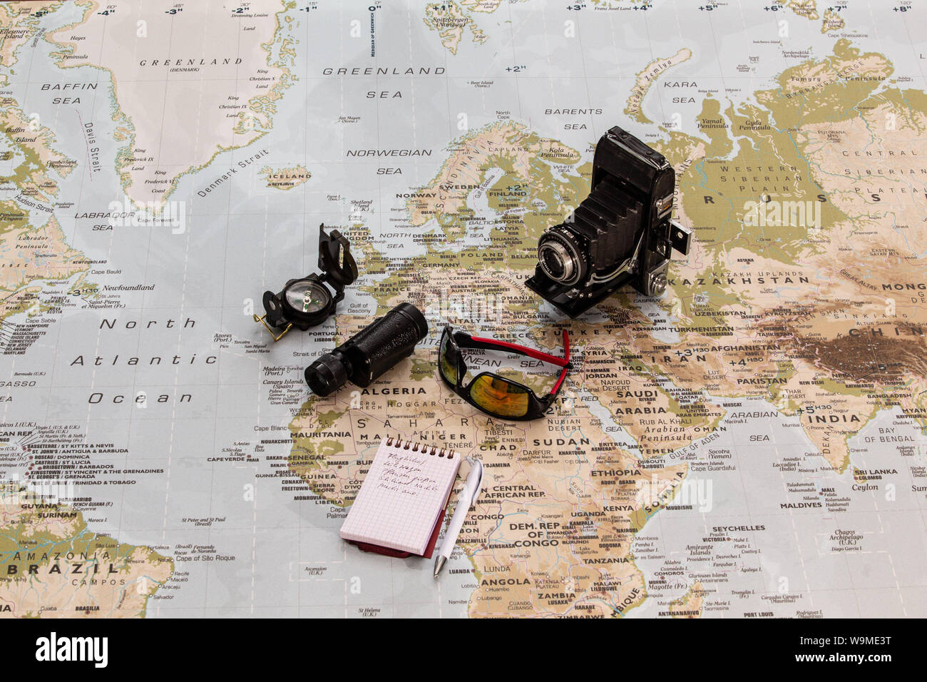 a worldmap with tools for traveling Stock Photo - Alamy