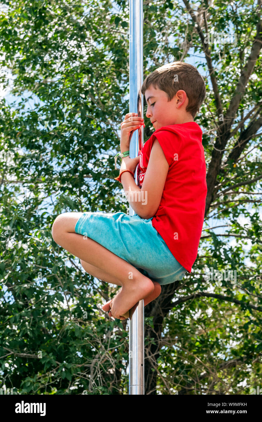 Child performing pole act; Salida Circus summer camp finale; Salida ...