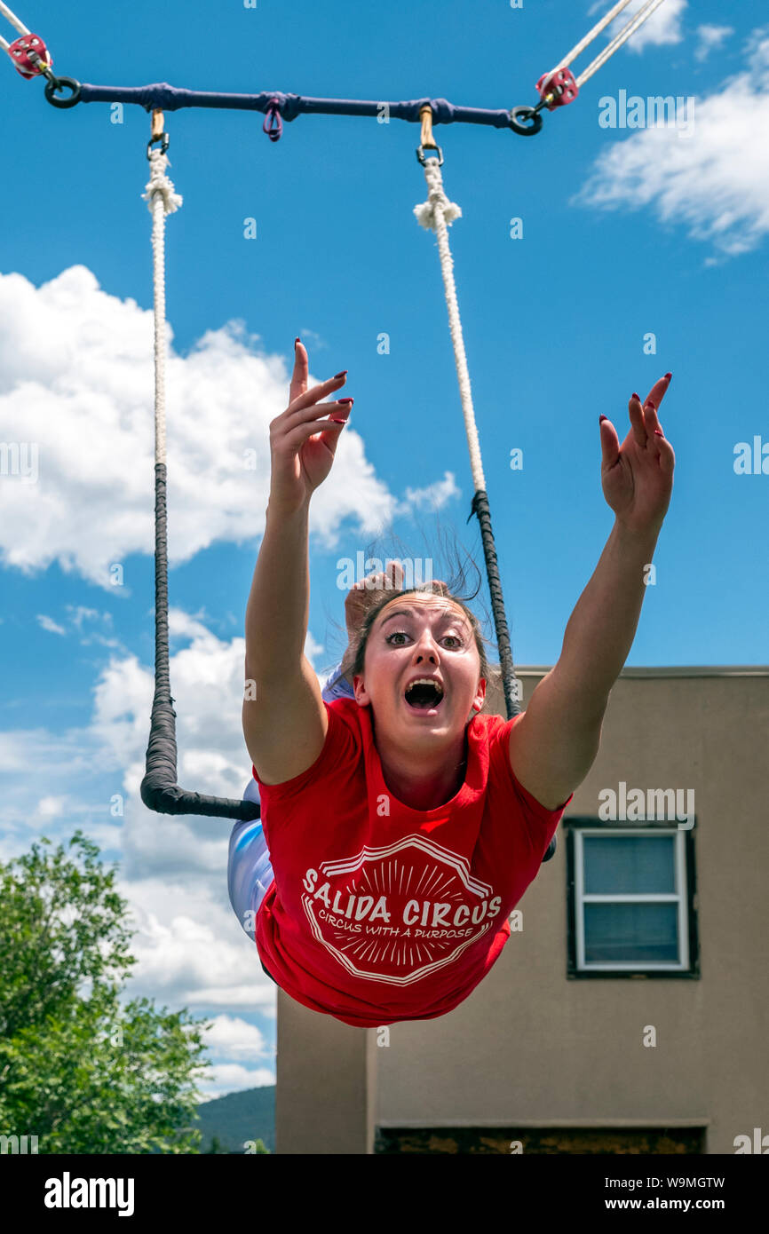 Young woman performing on trapeze; Salida Circus summer camp finale ...