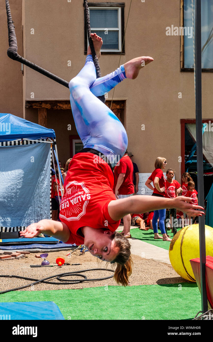 Young woman performing on trapeze; Salida Circus summer camp finale ...
