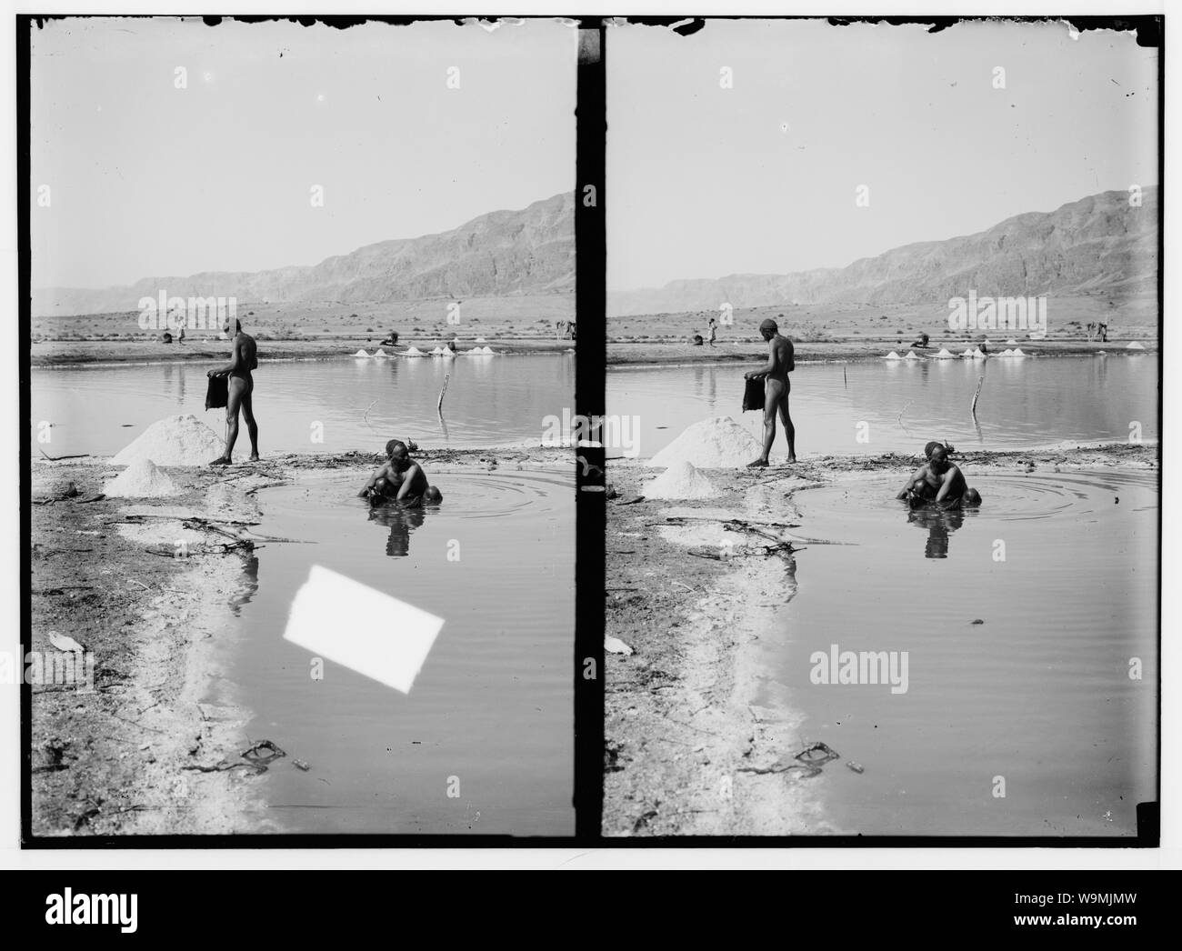 Around the Dead Sea. Collecting salt from lagoon Stock Photo - Alamy