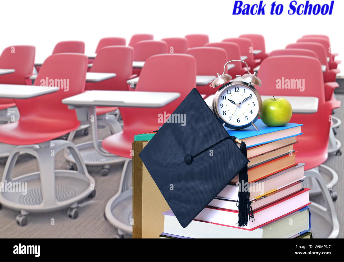 books and back to school concept in an empty classroom against white ...