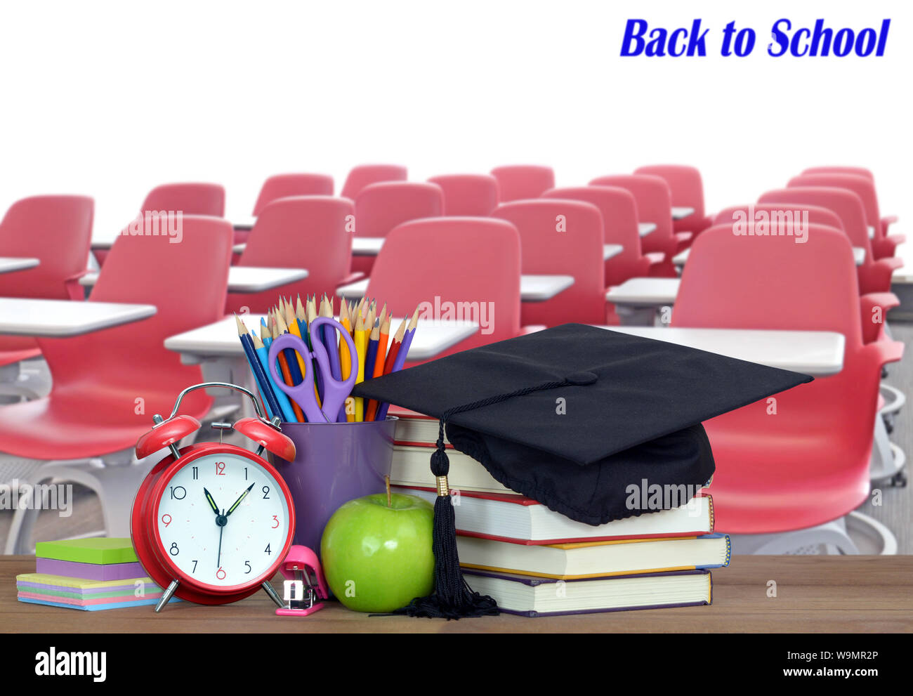 books and back to school concept in an empty classroom against white ...