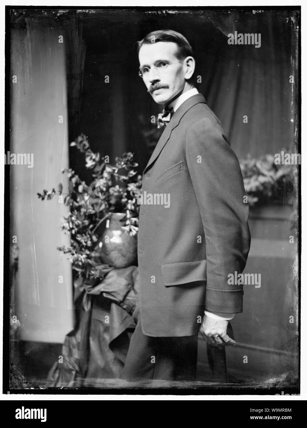 Arthur B. Davies (1862-1928), the American painter, posed in the ...