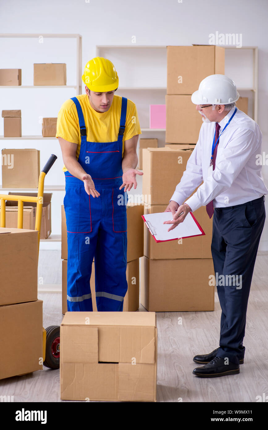 The professional movers doing home relocation Stock Photo - Alamy