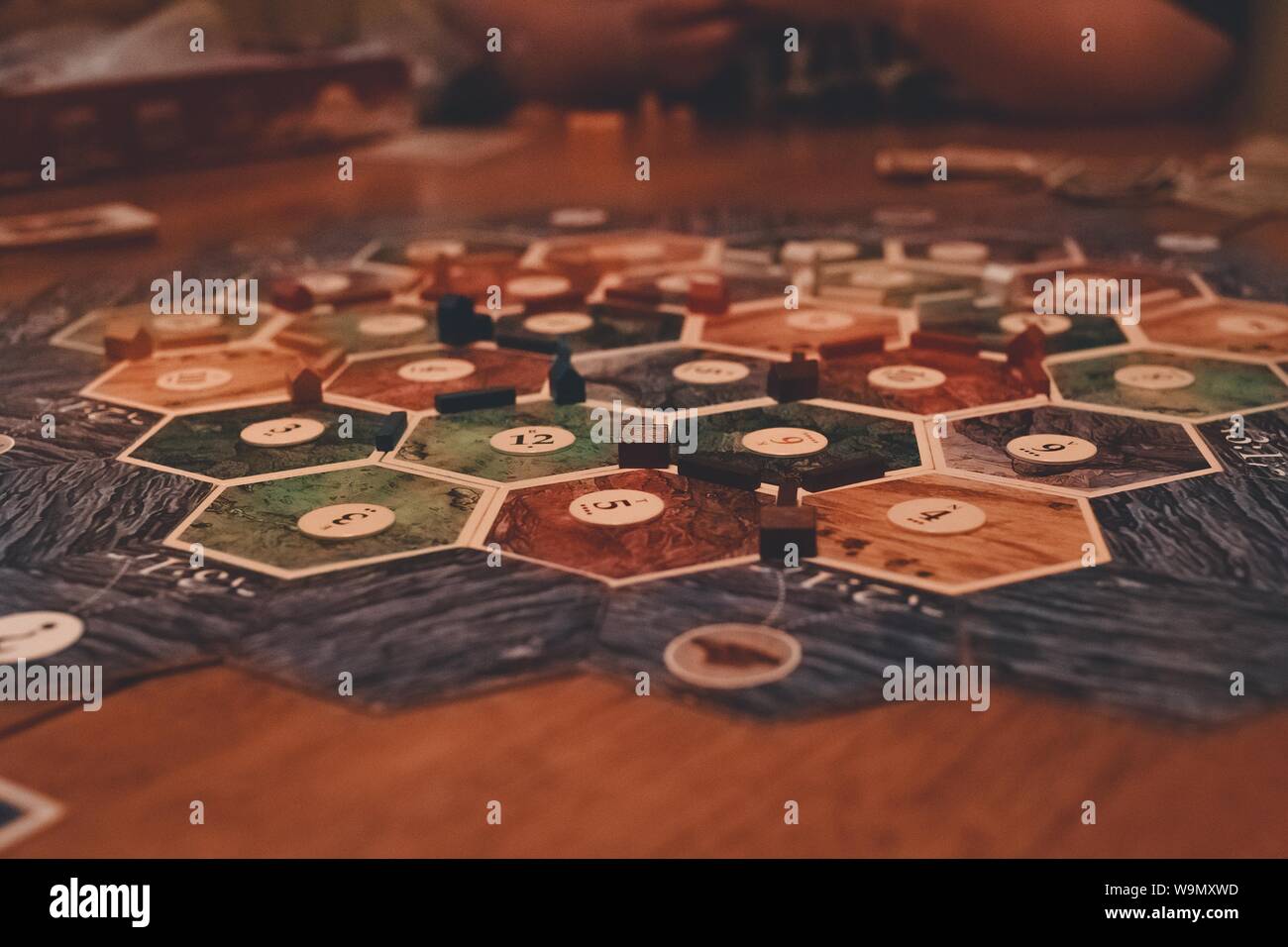 Family playing a board game on a table hi-res stock photography and ...