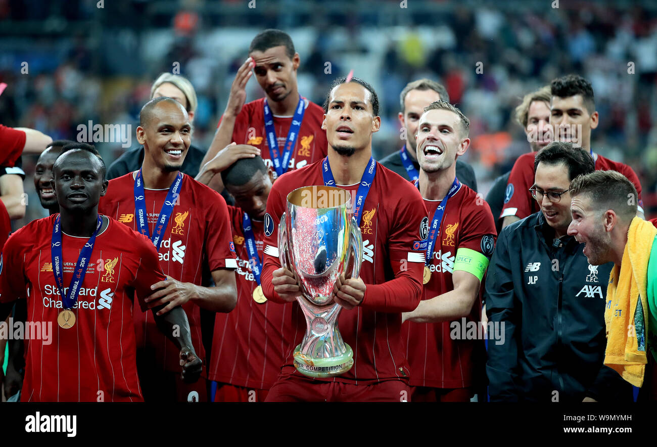 Liverpool's Virgil van Dijk celebrates with the trophy after victory in ...