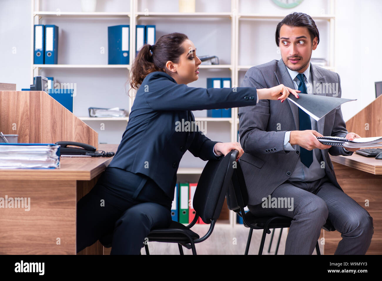 The two employees working in the office Stock Photo - Alamy