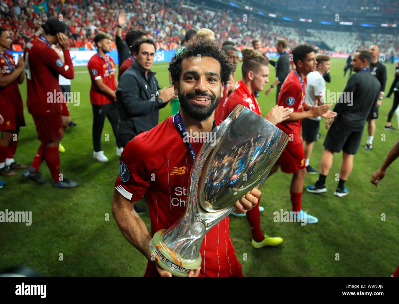 Liverpool's Mohamed Salah celebrates with the trophy after his side win ...